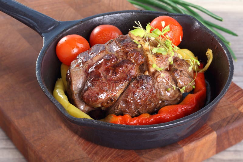 Roast beef in a frying pan stock image. Image of protein - 54265591