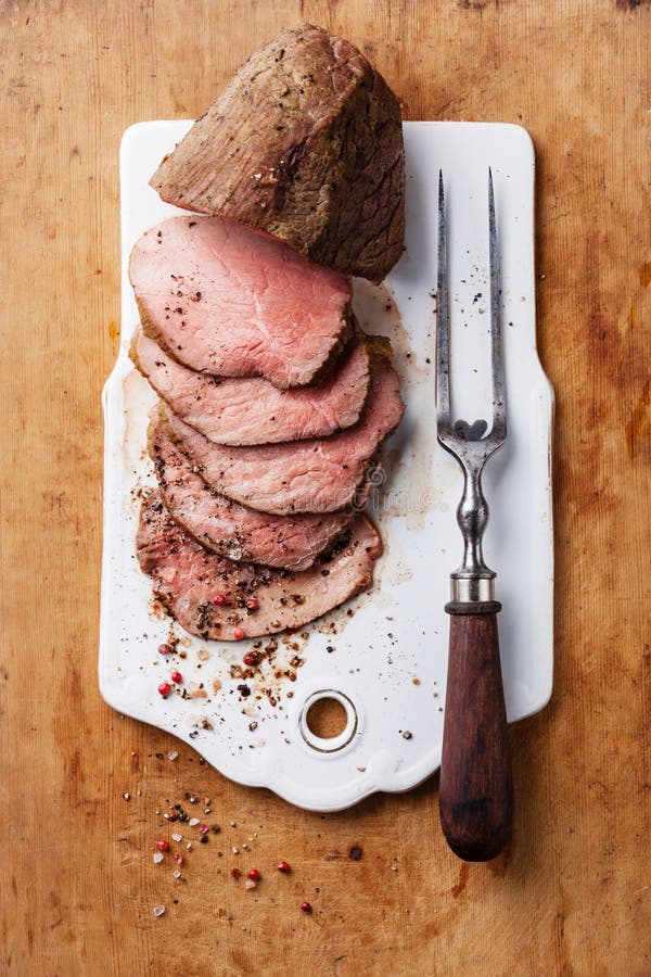 Roast beef and meat fork stock image. Image of cutting - 38745943