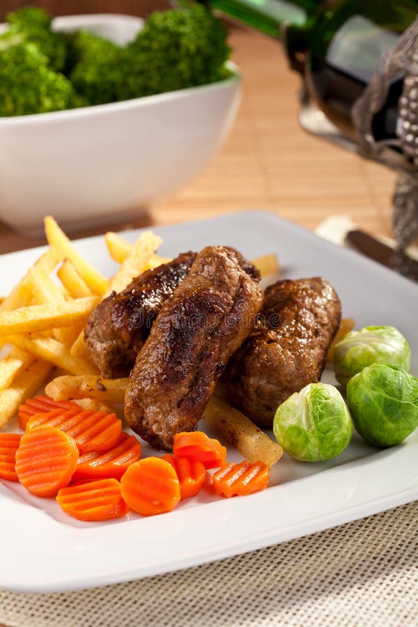 Roast Beef Rolls with Chips and Vegetables Stock Photo - Image of ...