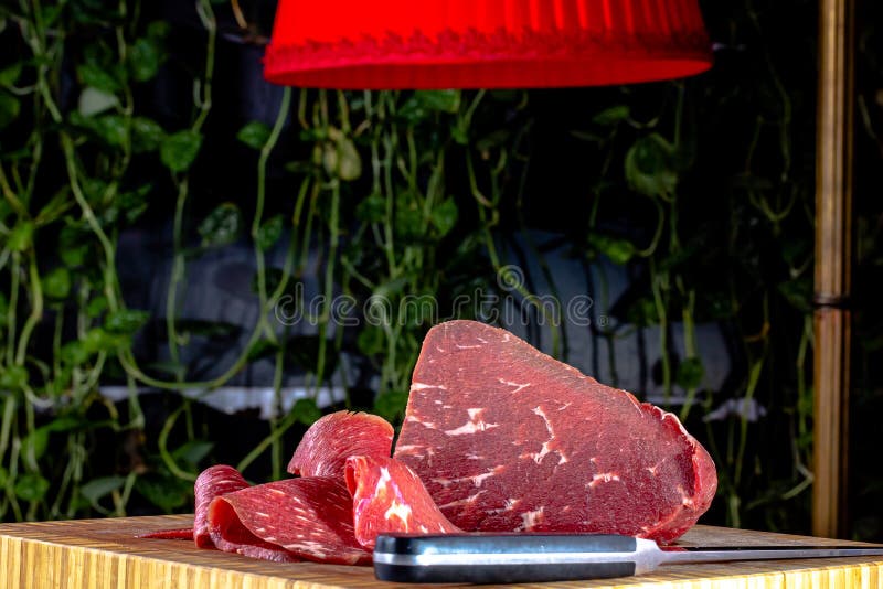 Roast Beef. Thin Slices of Raw Marbled Beef Lie on the Board Stock ...