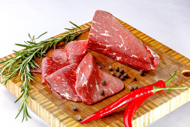 Roast Beef. Thin Slices of Raw Marbled Beef Lie on the Board Stock ...
