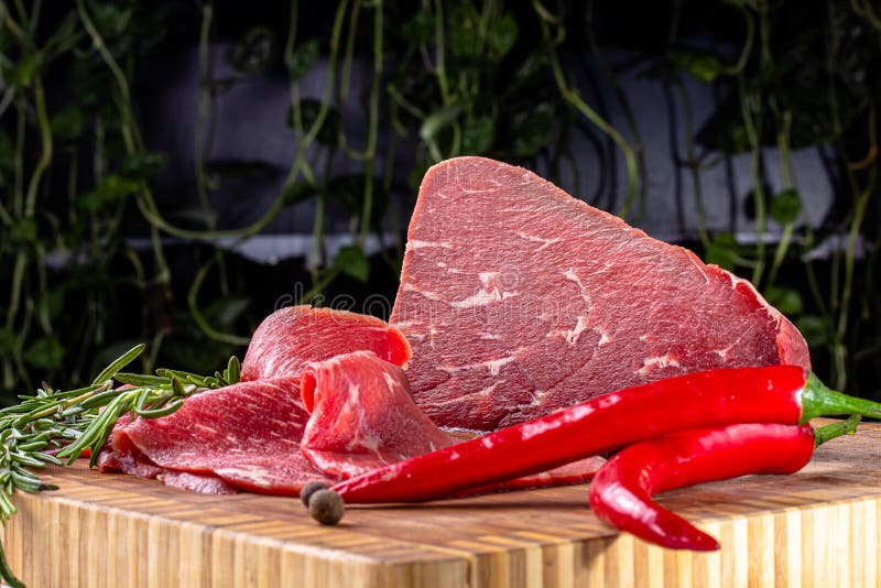 Roast Beef. Thin Slices of Raw Marbled Beef Lie on the Board Stock ...