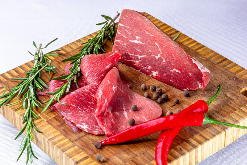 Roast Beef. Thin Slices of Raw Marbled Beef Lie on the Board Stock ...