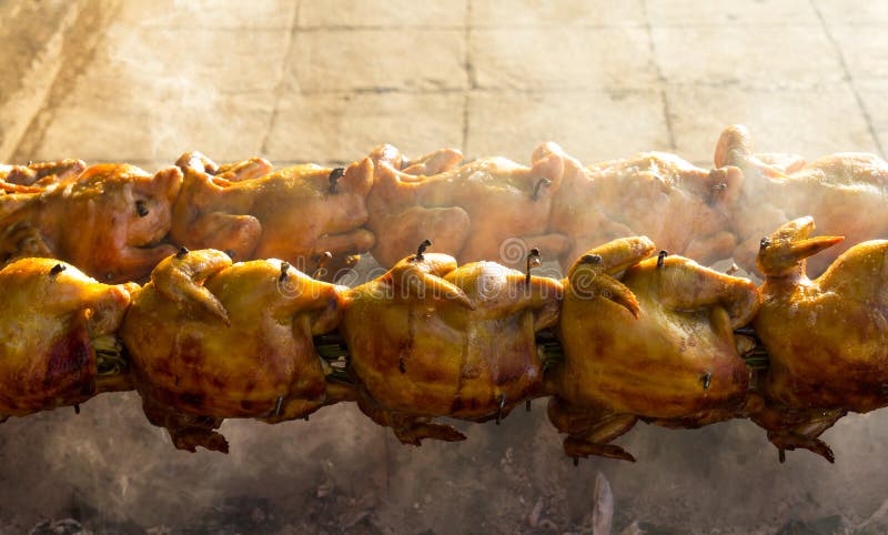 Rotating Spit Roast Chicken on an Open Charcoal Fire Stock Photo ...