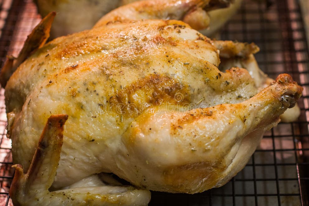 Roast Chicken on a Cooling Rack Stock Photo - Image of brown, herb ...