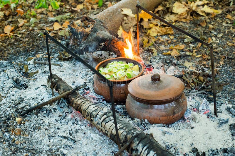 Roast in a Clay Pot Over Charcoal Stock Photo - Image of fishing, flame ...