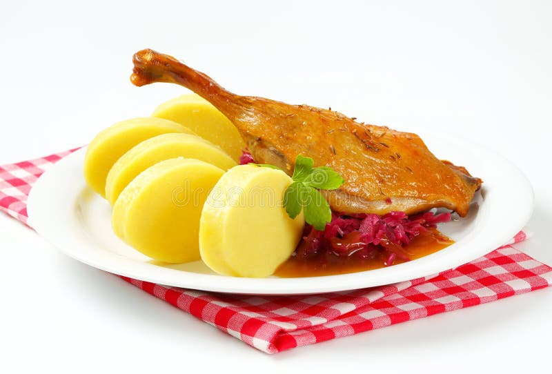 Roast Duck with Potato Dumplings and Red Cabbage Stock Photo - Image of ...