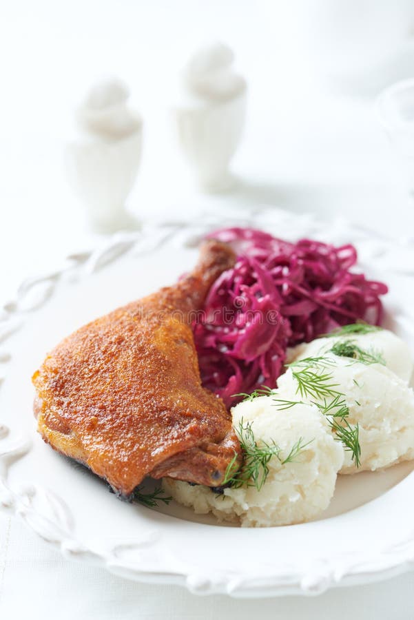 Roast Duck with Red Cabbage and Mashed Potatoes on Bright Background ...