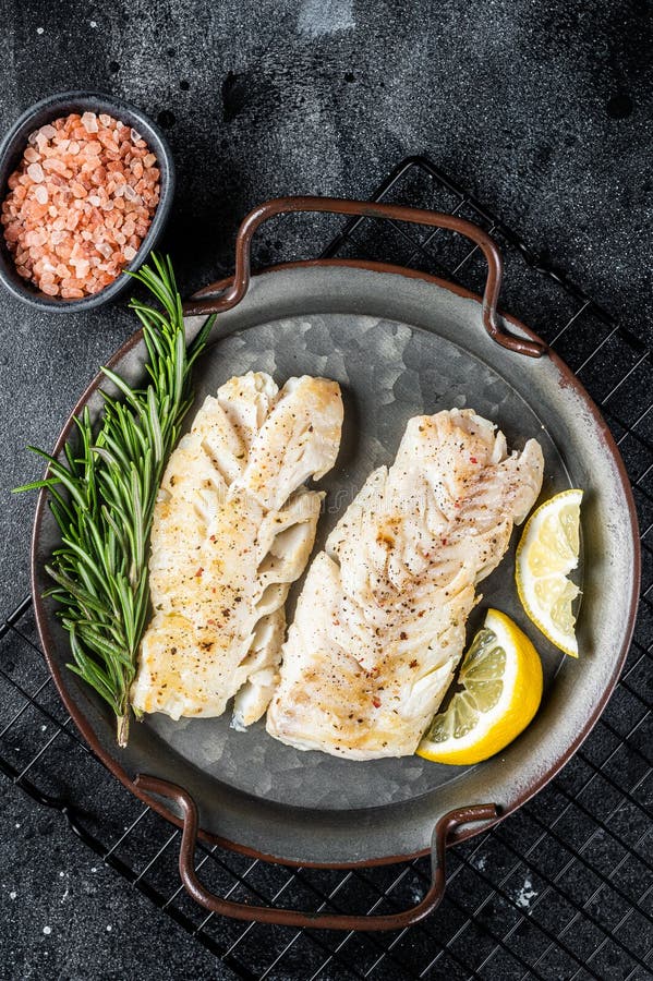 Roast Fillets of Codfish, Cooked Cod Fish Meat. Black Background Stock ...