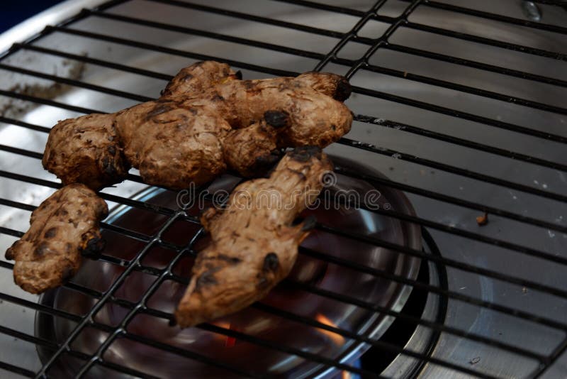 Roast the Ginger before Pounding it Using a Grill Pan Stock Photo ...