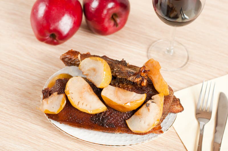 Roast goose with apple stock photo. Image of grilled - 23477438