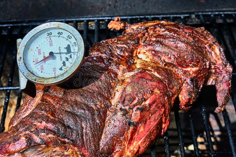 Roast Lamb with Inserted Meat Thermometer on the Grill Rack Stock Image ...