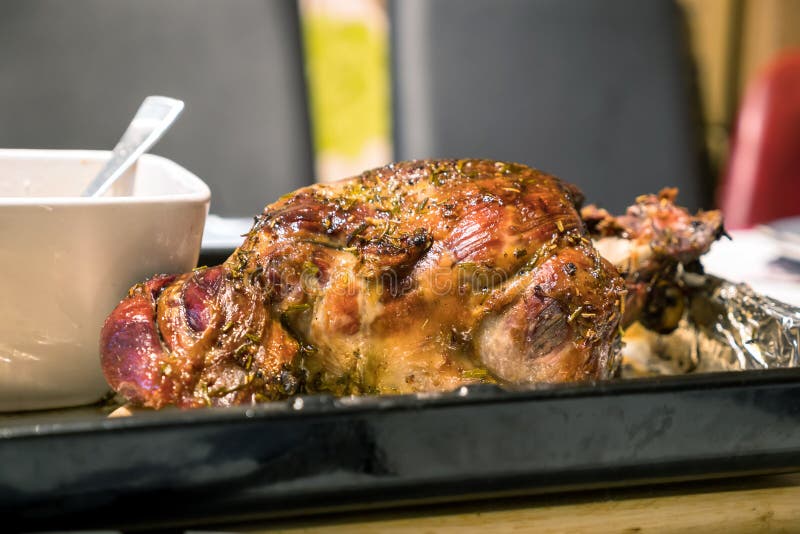 A Roast Leg of Lamb on Baking Tray on Christmas Table Stock Photo ...