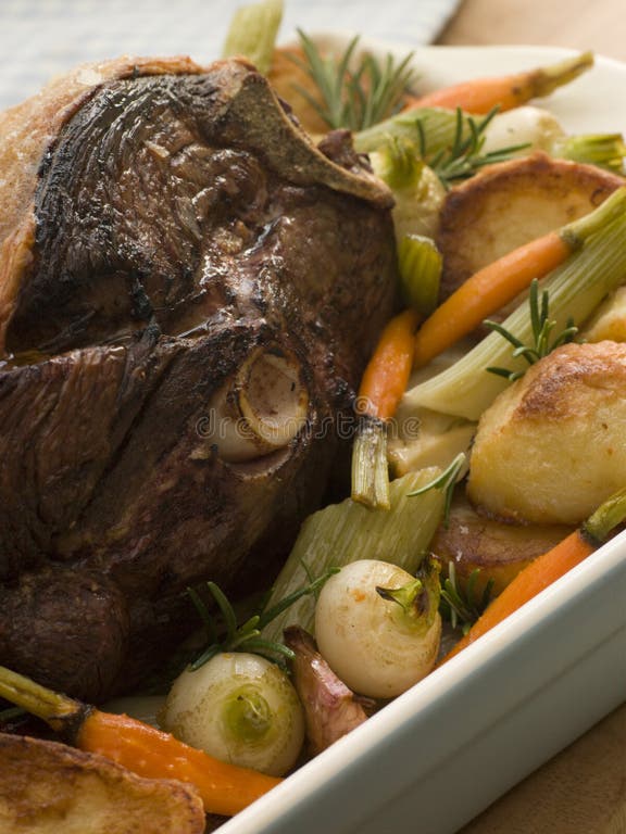 Roast Leg of Spring Lamb with Roast Potatoes Stock Photo - Image of ...