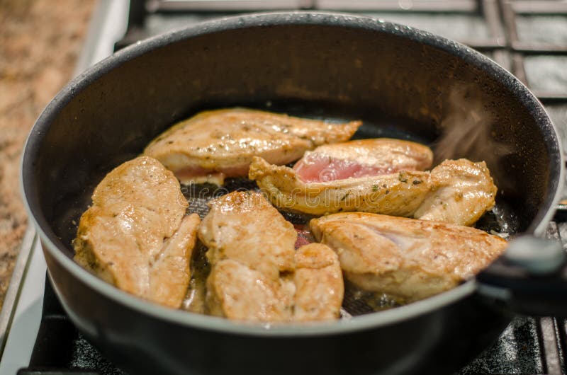 Roast the meat in the pan stock photo. Image of fried - 181412716