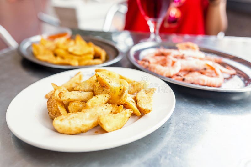 Potatoes with Herbs on the Table in Restaurant Stock Photo - Image of ...