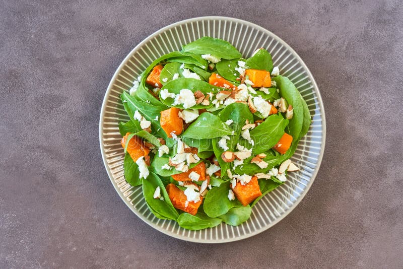 Roast Pumpkin, Spinach, Almond and Feta Salad. Top View Stock Photo ... Roast Pumpkin, Spinach, Almond and Feta Salad. Top View Stock Photo ...