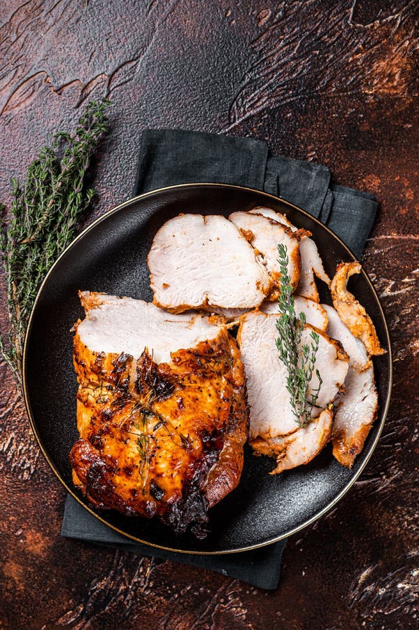 Roast Rolled Pork Ham Meat on Plate with Thyme. Dark Background Stock ...