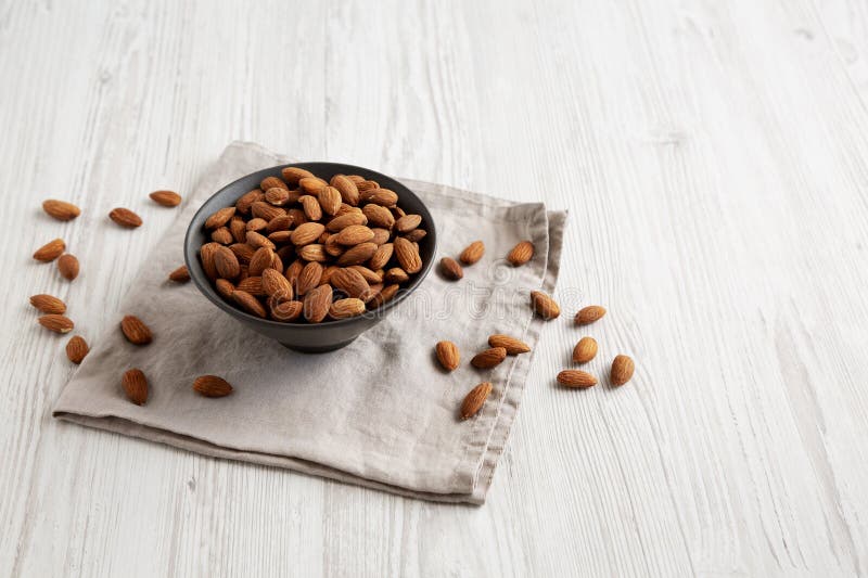 Roasted Almonds in a Bowl, Side View. Copy Space Stock Photo - Image of ...