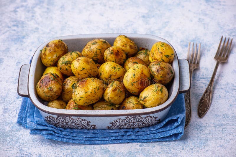 Roasted Baby Potatoes with Garlic and Herb, on Light Background Stock ...