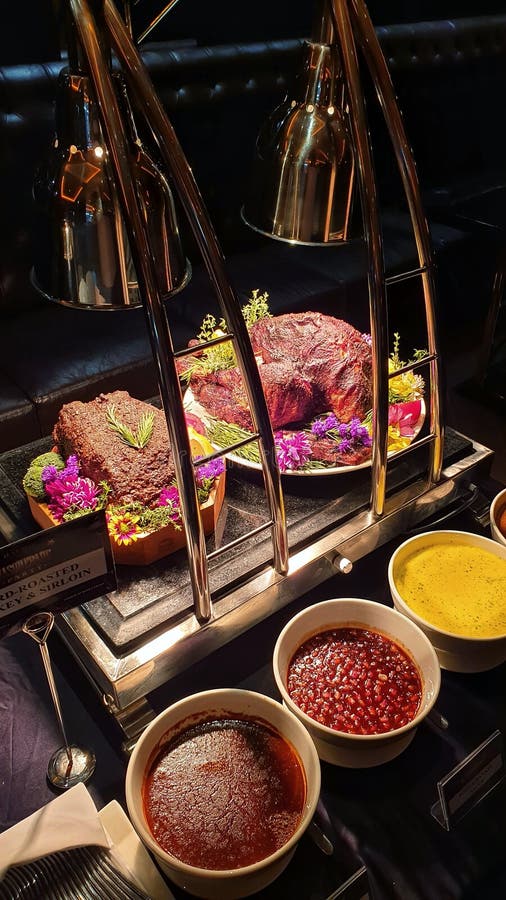 Roasted Beef & Sirloin Display on Carving Lamp Stock Image - Image of ...