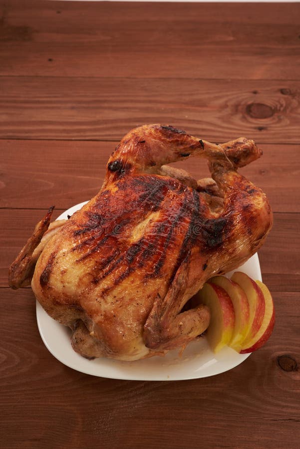 Roasted Bird on a Wooden Table Stock Image - Image of portion ...