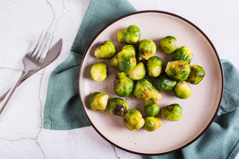 Roasted Brussels Sprouts on a Plate on the Table. Vegetarian Diet. Top ...