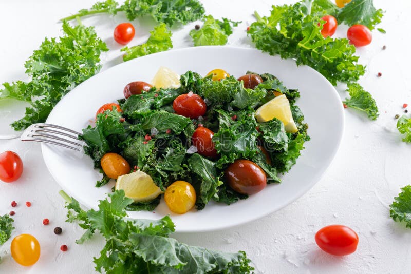 Roasted Cabbage with Kale and Cherry Tomatoes and Lemon Slices Stock ...