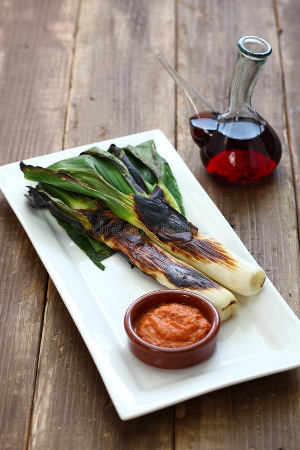 Roasted Calcots with Romesco Sauce for Dipping Stock Photo - Image of ...