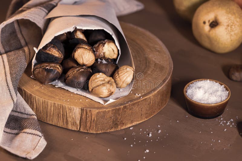 Roasted Chestnuts in a Paper Cone Stock Photo - Image of paper, fruit ...