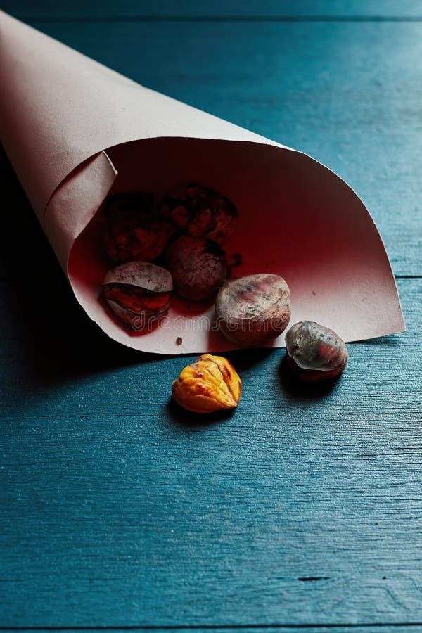 Roasted Chestnuts in a Paper Stock Image - Image of cold, crust: 199649795