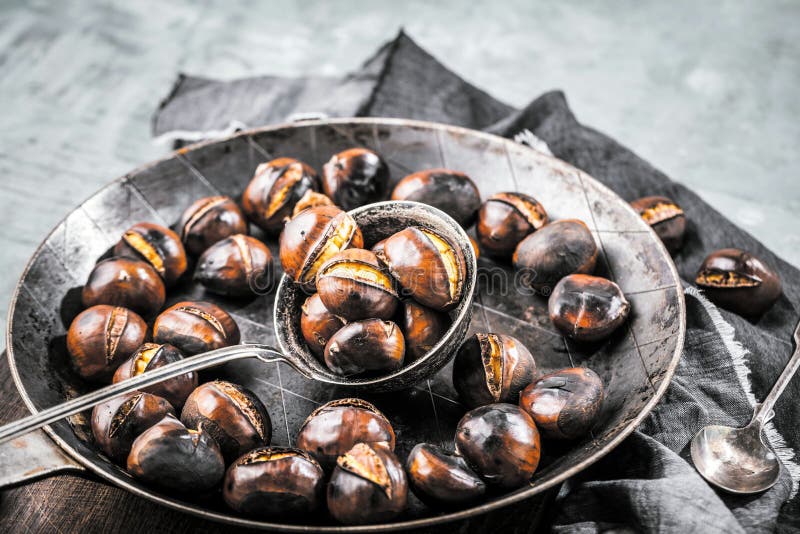 Roasted Chestnuts Served in Chestnut Pan on an Old Table. Stock Image ...