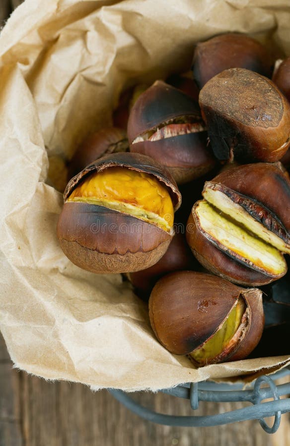 Roasted Chestnuts on Wooden Surface Stock Photo - Image of edible ...