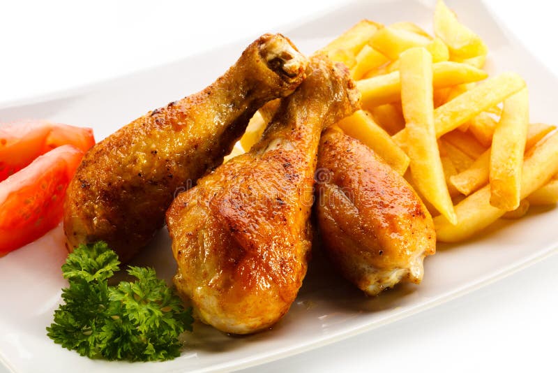 Roasted Chicken Drumsticks with Chips Stock Photo - Image of coated ...
