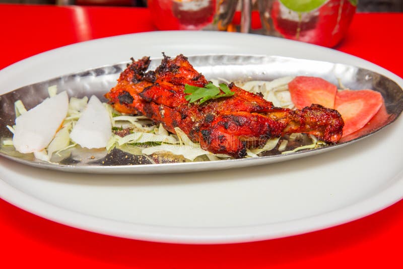 Roasted chicken leg piece stock photo. Image of drumstick - 66390408