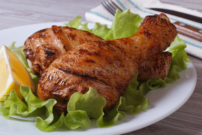 Roasted Chicken Legs with Salad and a Slice of Lemon Stock Image ...