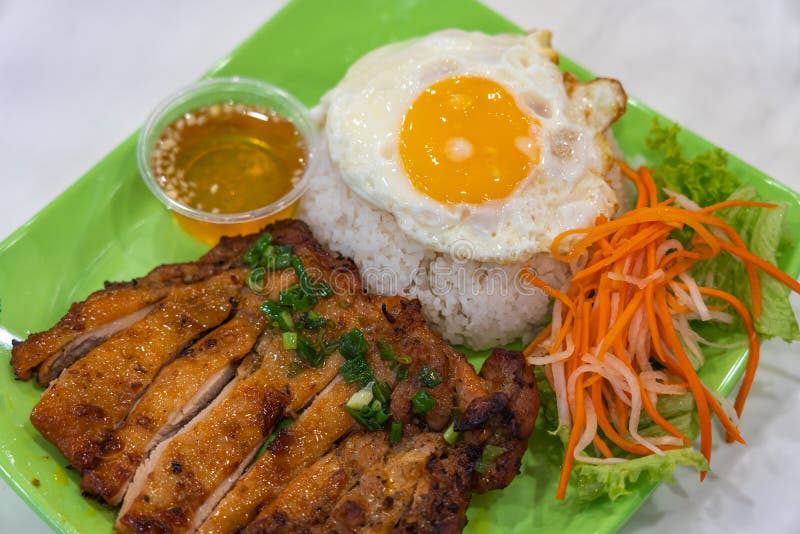 Roasted Chicken Rice Served with Sunny Egg and Pickles Stock Image ...