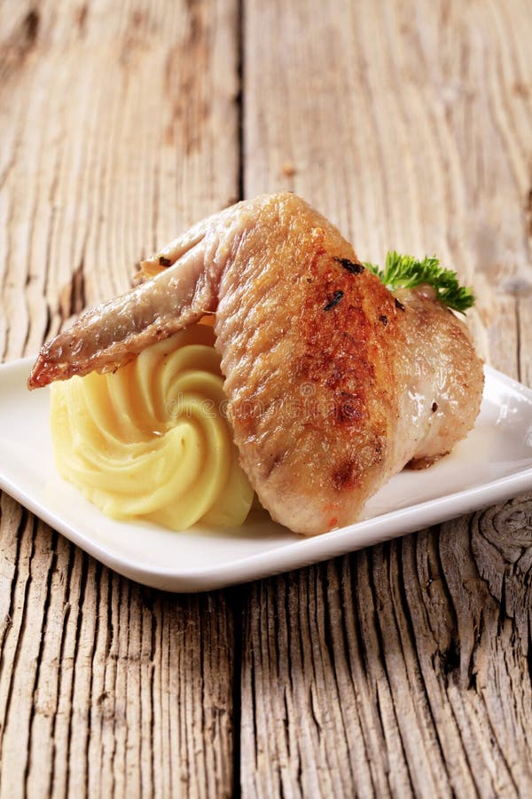 Roasted Chicken Wing and Mashed Potato Stock Photo - Image of puree ...