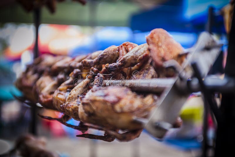 Roasted Chickens Grilled on Rotating Spit Over the Flames. Rotisserie ...