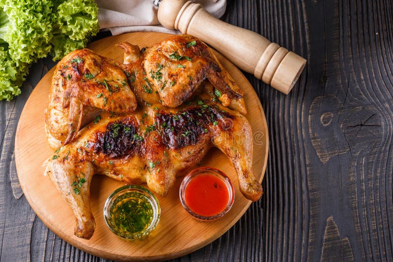 Roasted Chiken on Wooden Board with Sauce Stock Photo - Image of table ...