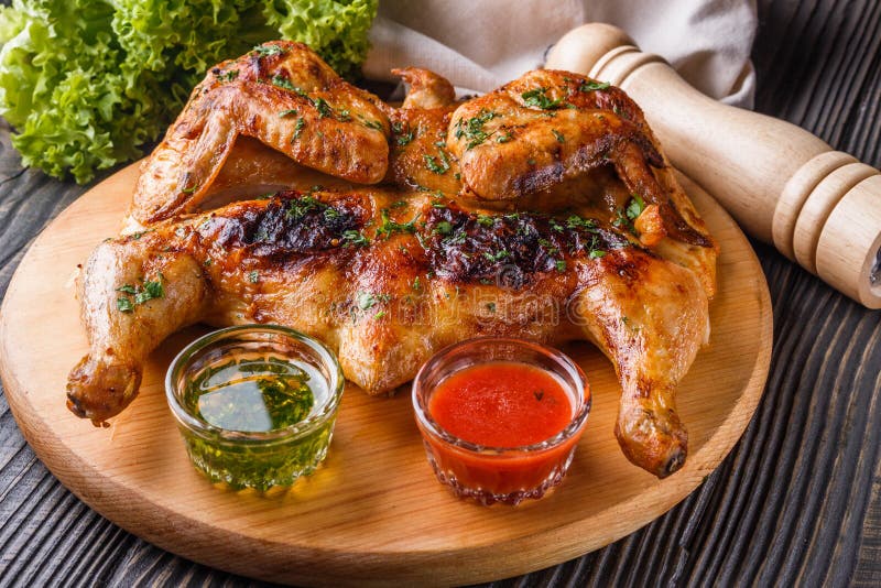 Roasted Chiken on Wooden Board with Sauce Stock Image - Image of board ...
