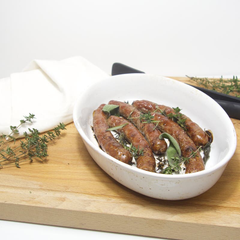 Roasted chipolata sausages stock image. Image of dish - 47336269
