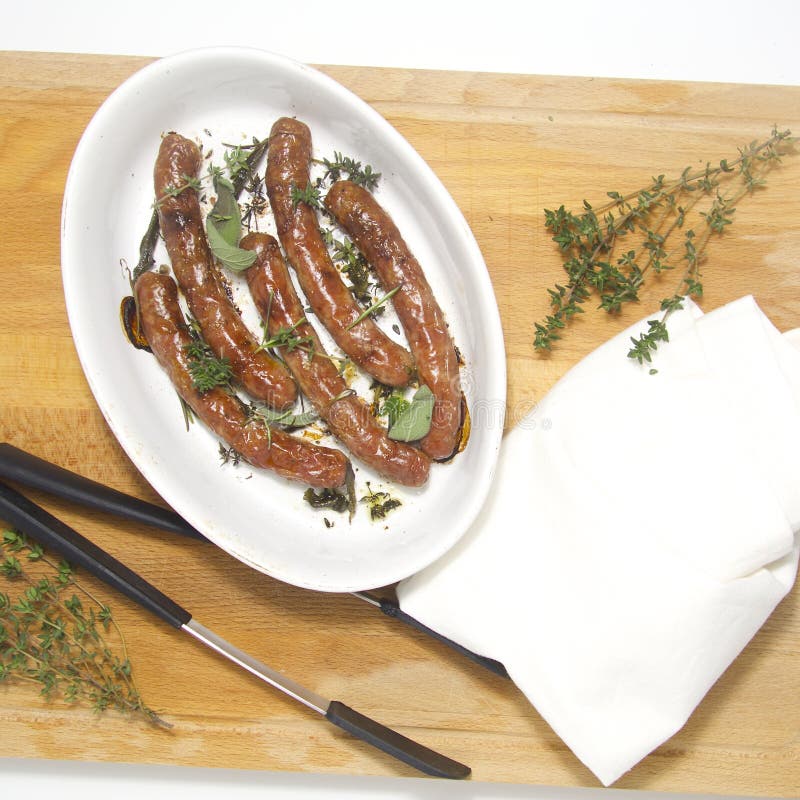 Roasted chipolata sausages stock photo. Image of dish - 47336582