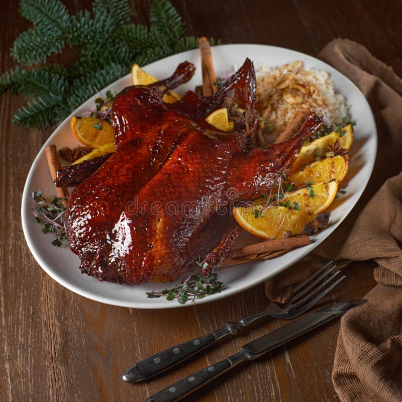 Roasted Christmas Duck with Green Tree Branch on Wooden Rustic Table ...