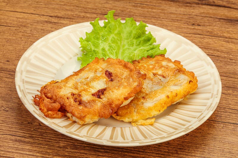 Roasted cod fish in bread stock image. Image of white - 195858631