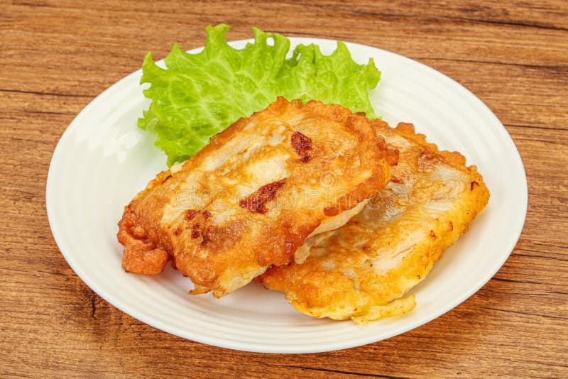 Roasted cod fish in bread stock image. Image of dish - 183373871