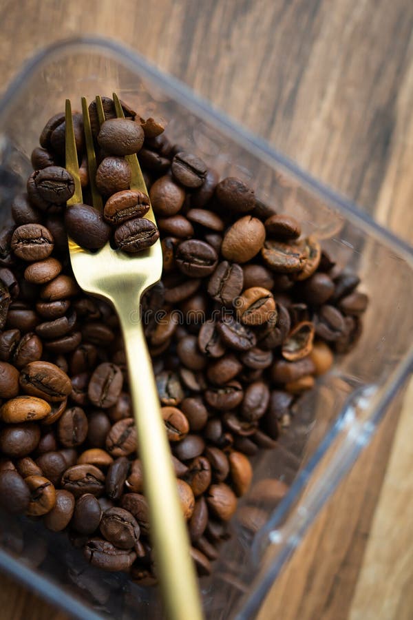 Roasted Coffee Bean in a Plastic Box Along with a Fork, Close-up, Top ...