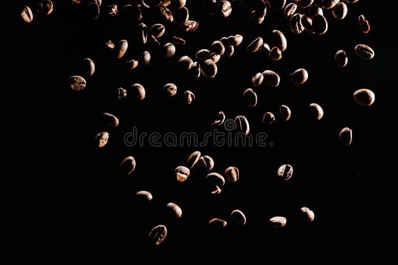 Roasted Coffee Beans Falling Against Black Background Stock Photo ...