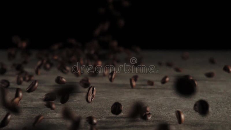 Roasted Coffee Beans Thrown Up from through the White Smoke on Black ...