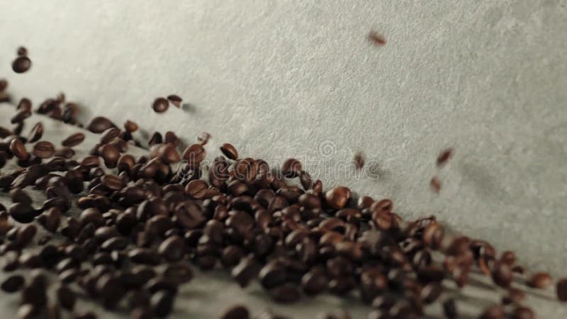 Roasted Coffee Beans Thrown Up from through the White Smoke on Black ...